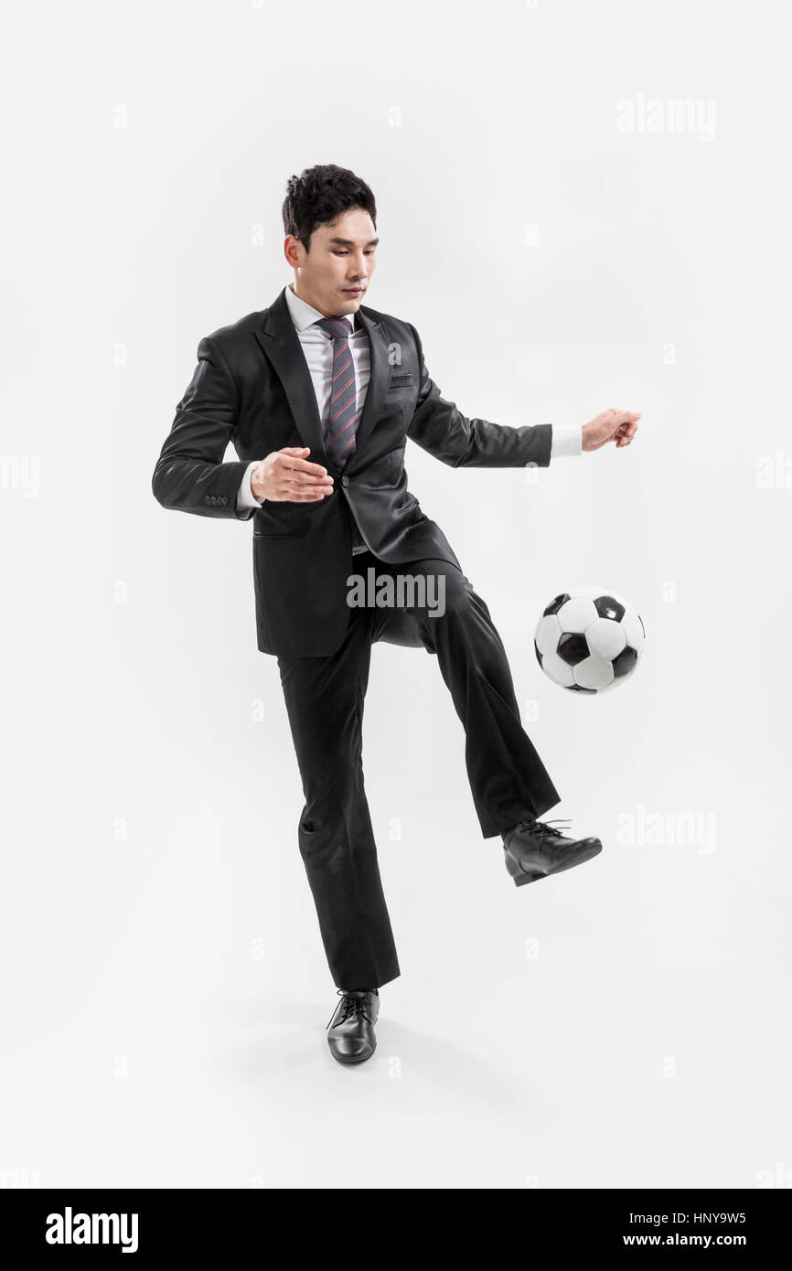 Playing the ball hi-res stock photography and images - Alamy