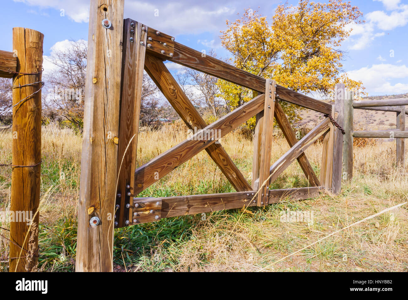 Wooden gate in fall pasture Stock Photo - Alamy