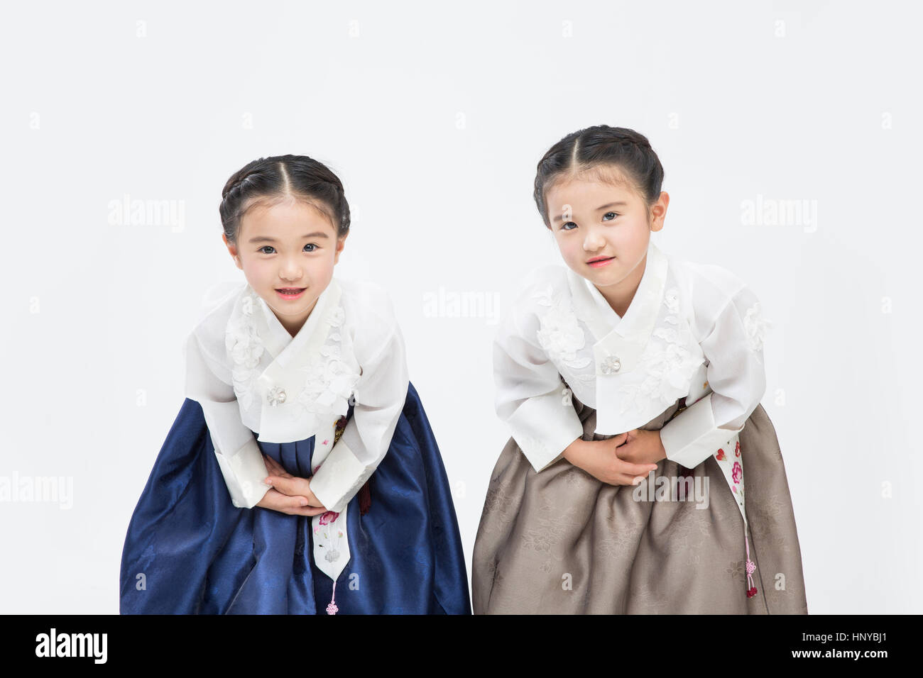 Smiling twin girls in traditional Korean clothes Stock Photo - Alamy
