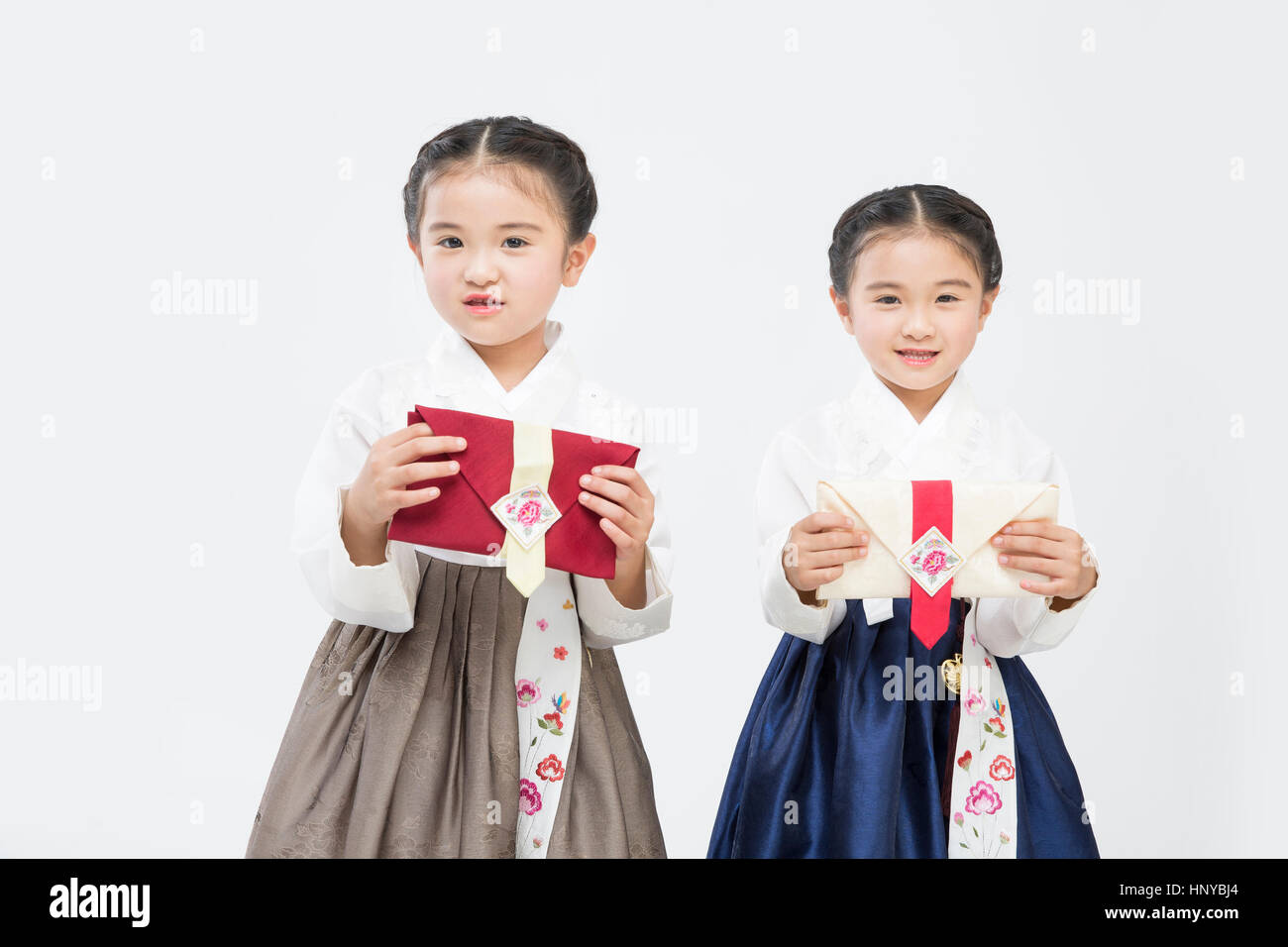 Smiling twin girls in traditional Korean clothes Stock Photo - Alamy