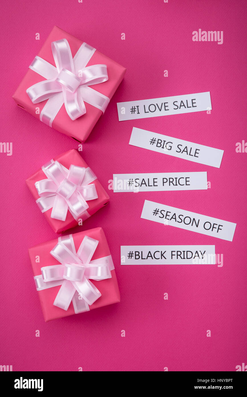 Present boxes with sale signs Stock Photo - Alamy