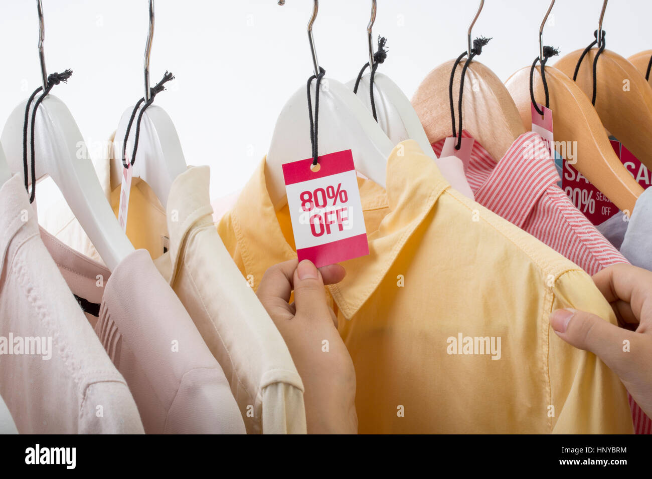 Clothes with sale sign Stock Photo - Alamy