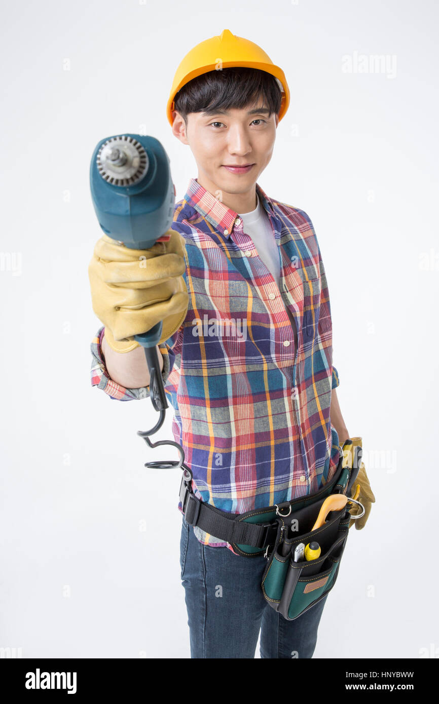 Young smiling construction worker Stock Photo - Alamy