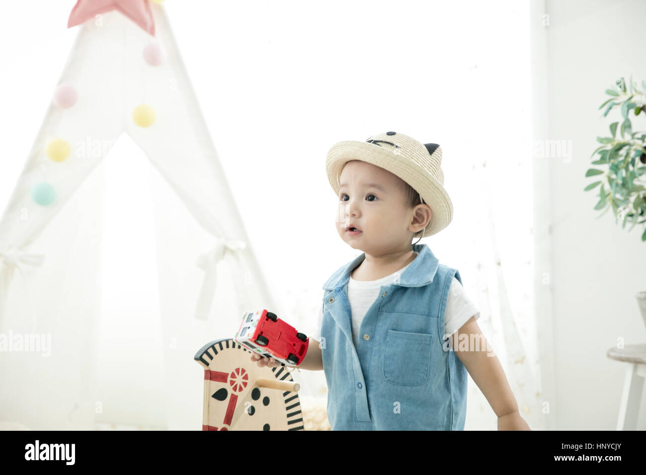 Baby boy with toy car Stock Photo - Alamy