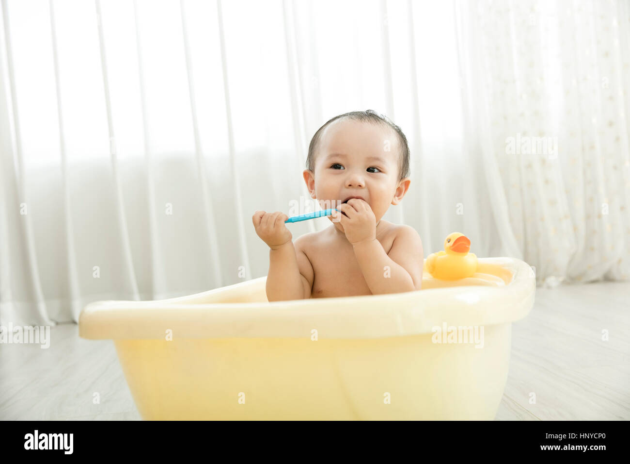 Boy in bathtub hi-res stock photography and images - Alamy