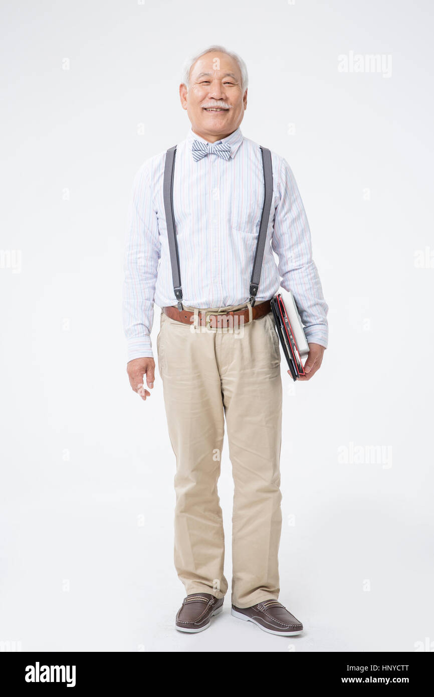 Senior man standing hi-res stock photography and images - Alamy