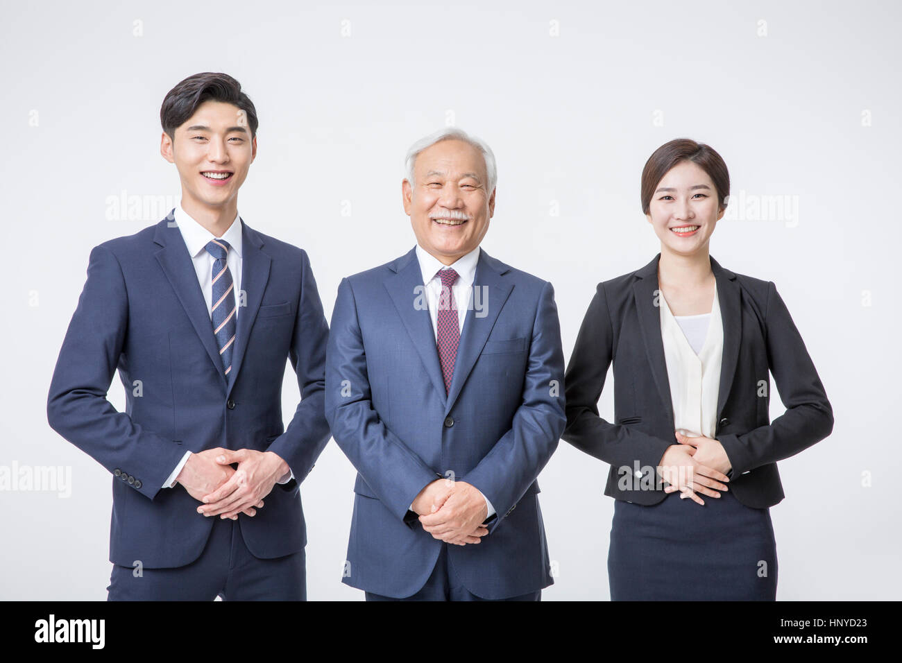 Smiling business people in suits Stock Photo - Alamy
