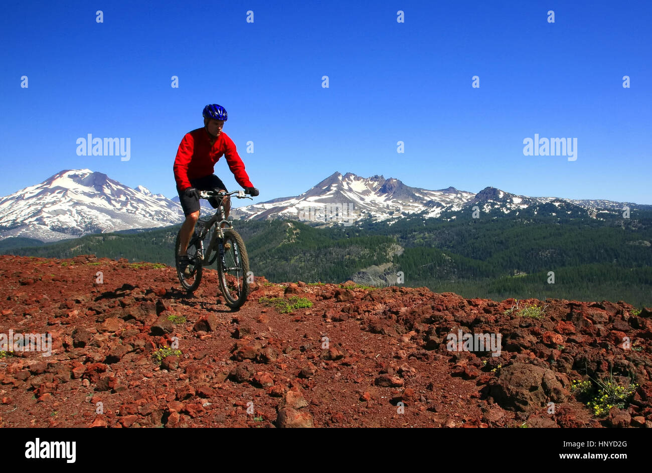Mountain Biker near the Summit of Mount Bachelor Overlooking the Three ...
