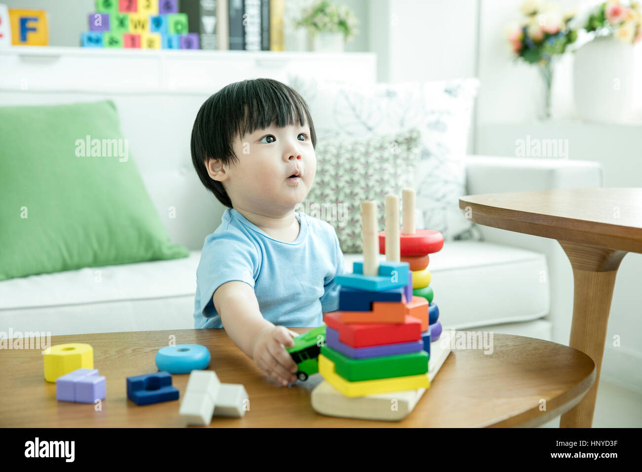 Baby boy playing with blocks Stock Photo - Alamy