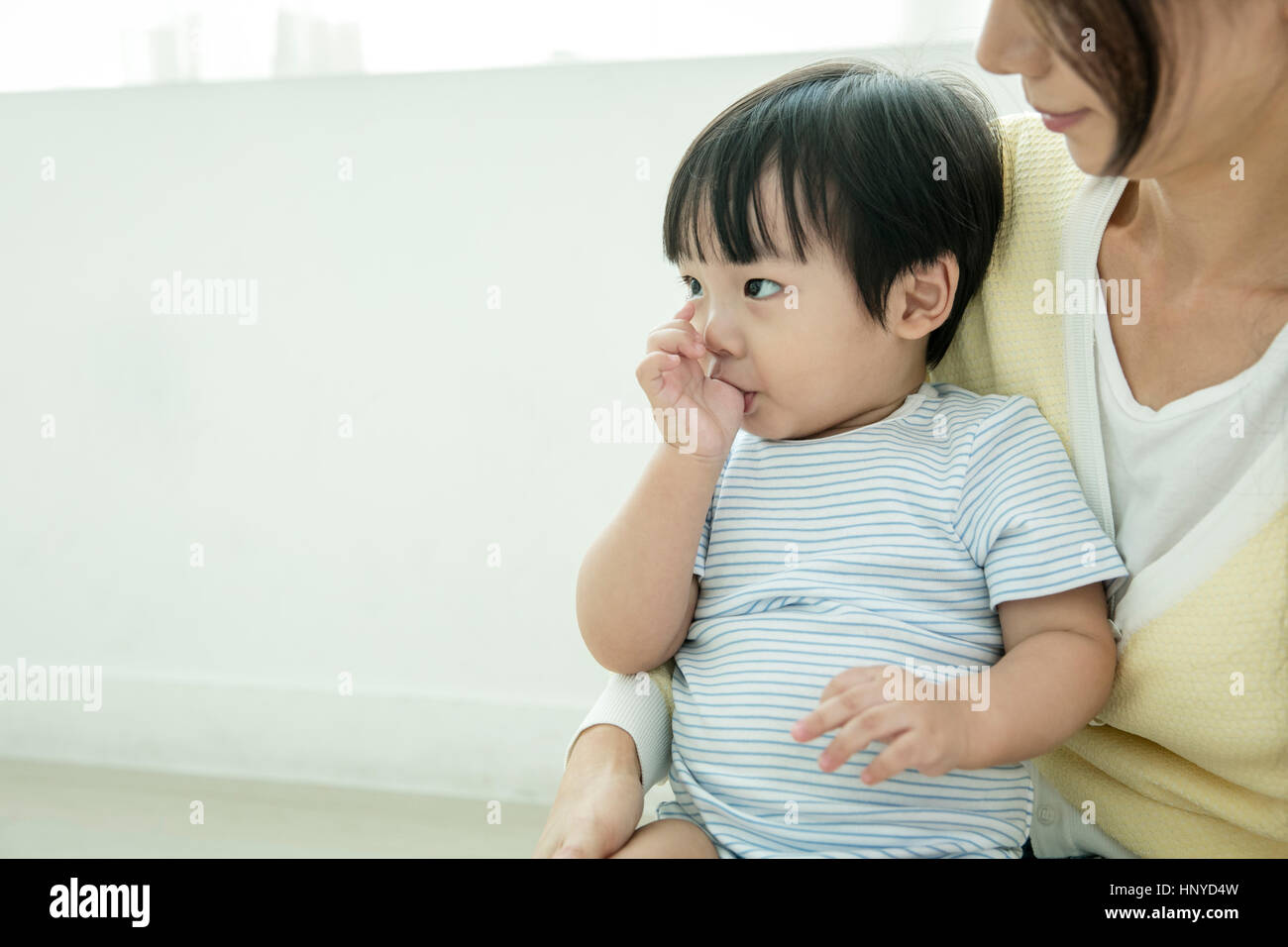Loving mother hugging baby son Stock Photo - Alamy