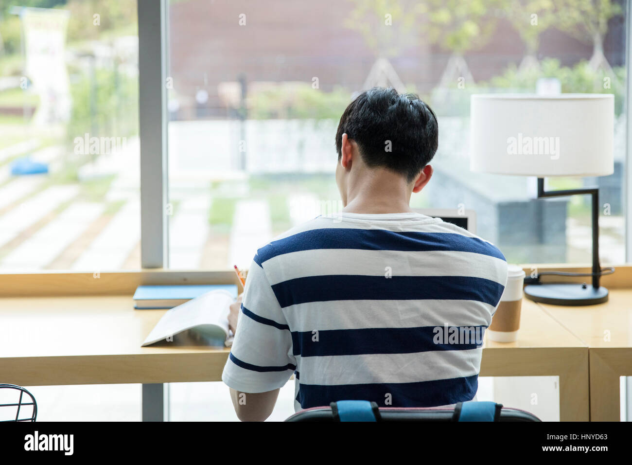 Back portrait of male college student Stock Photo - Alamy
