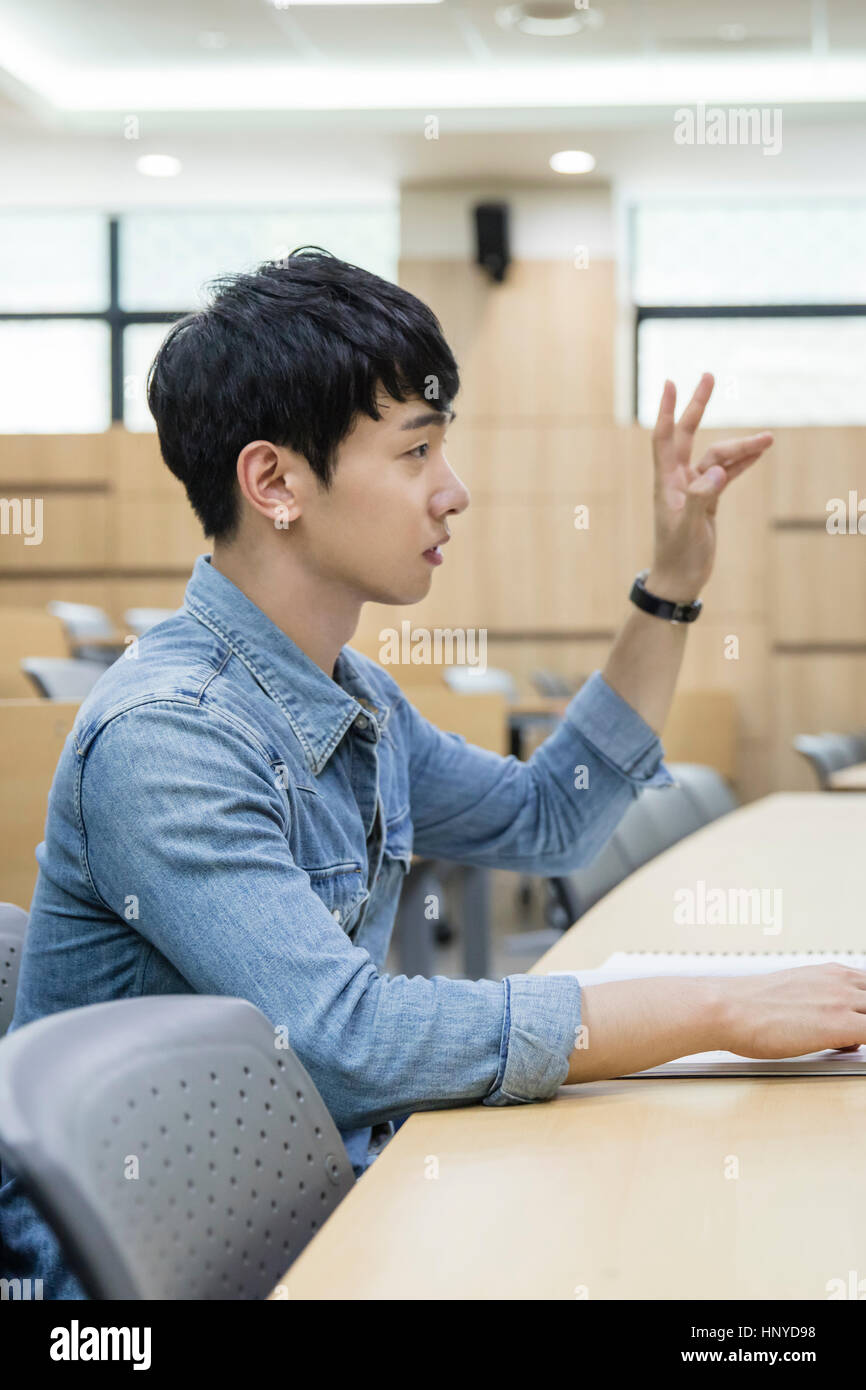 Side view portrait of male college student Stock Photo - Alamy