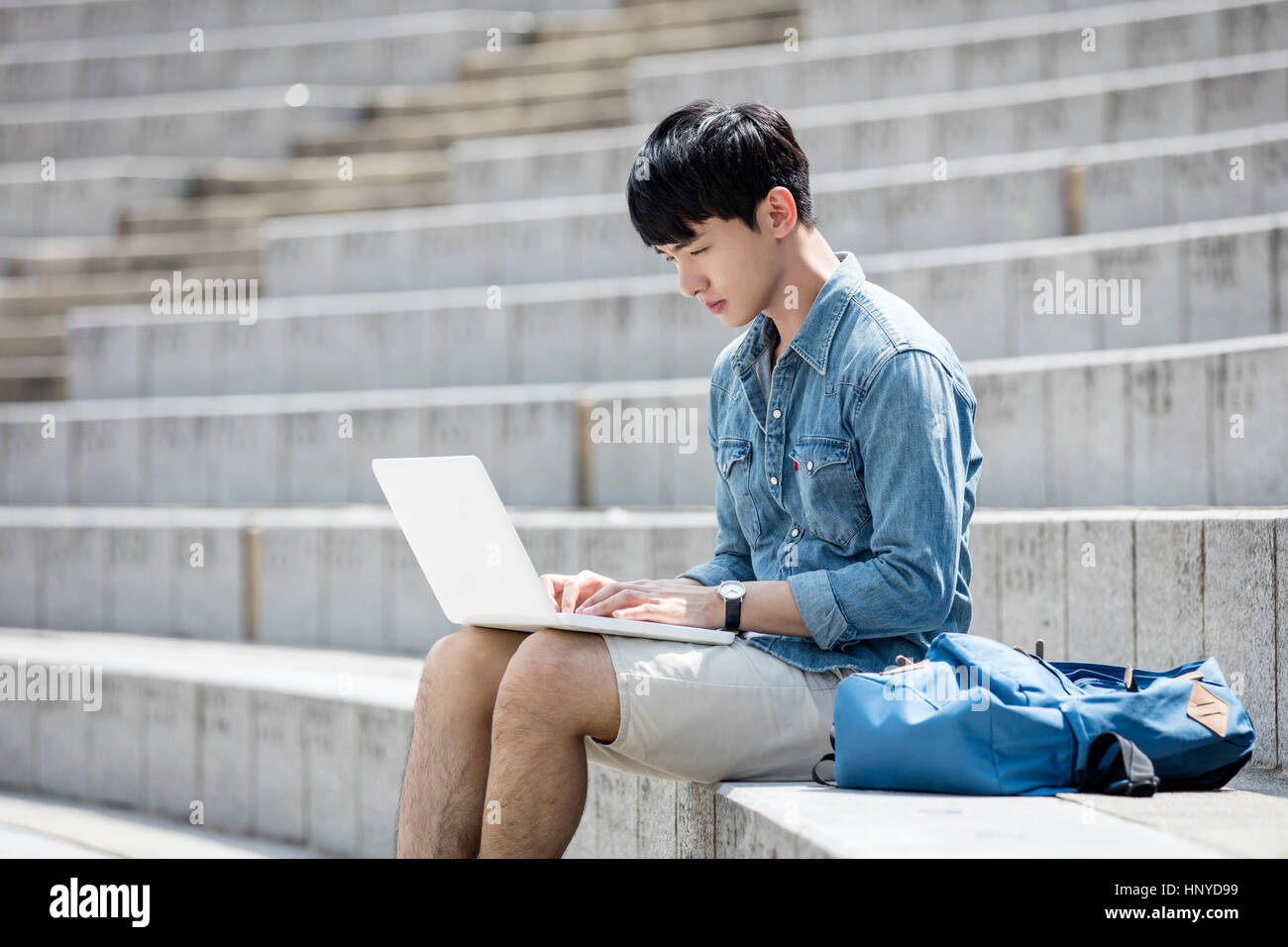 Male student typing laptop hi-res stock photography and images - Alamy