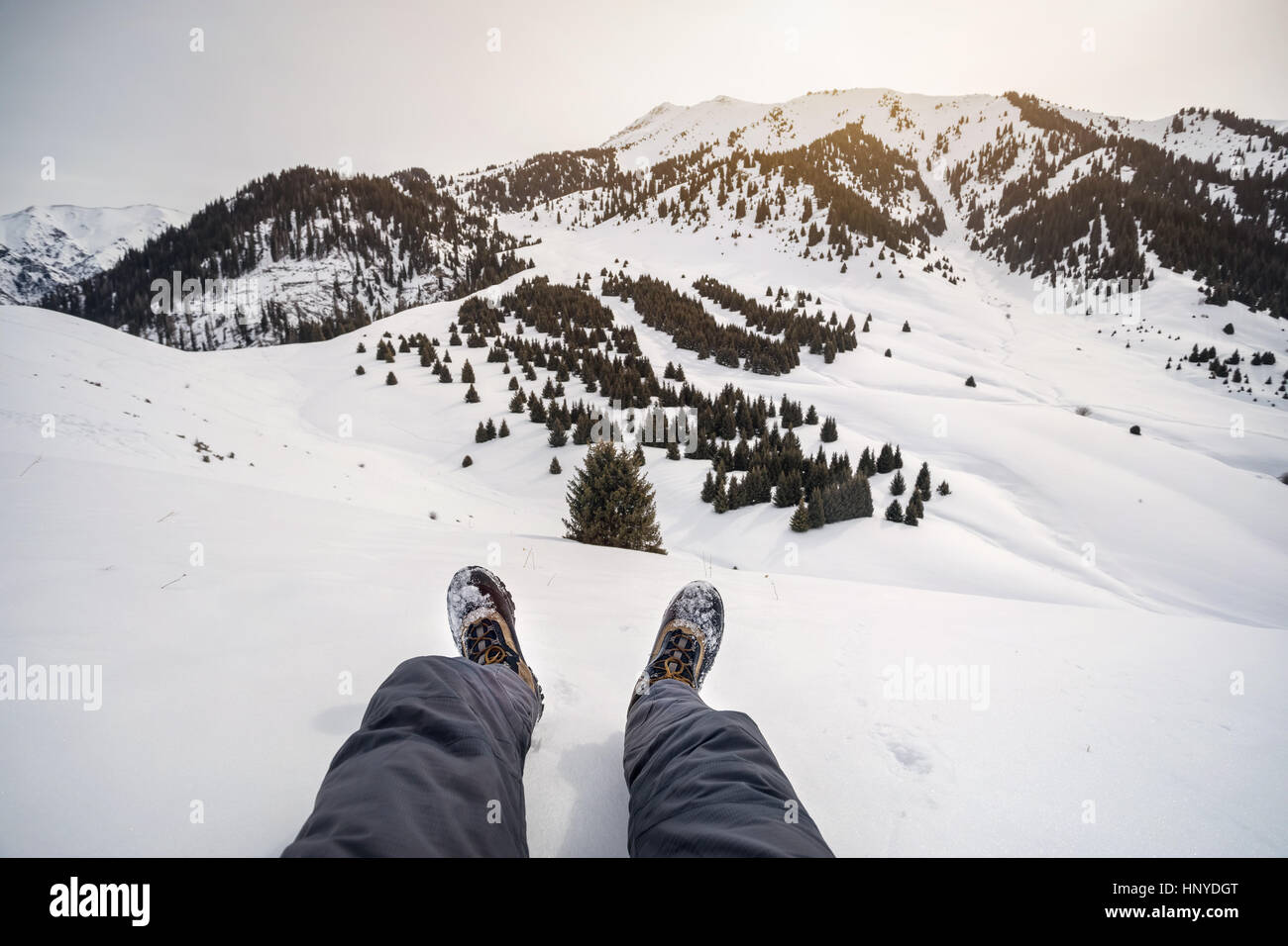 Hiker legs in tracking boots at amazing snowy mountains view Stock ...