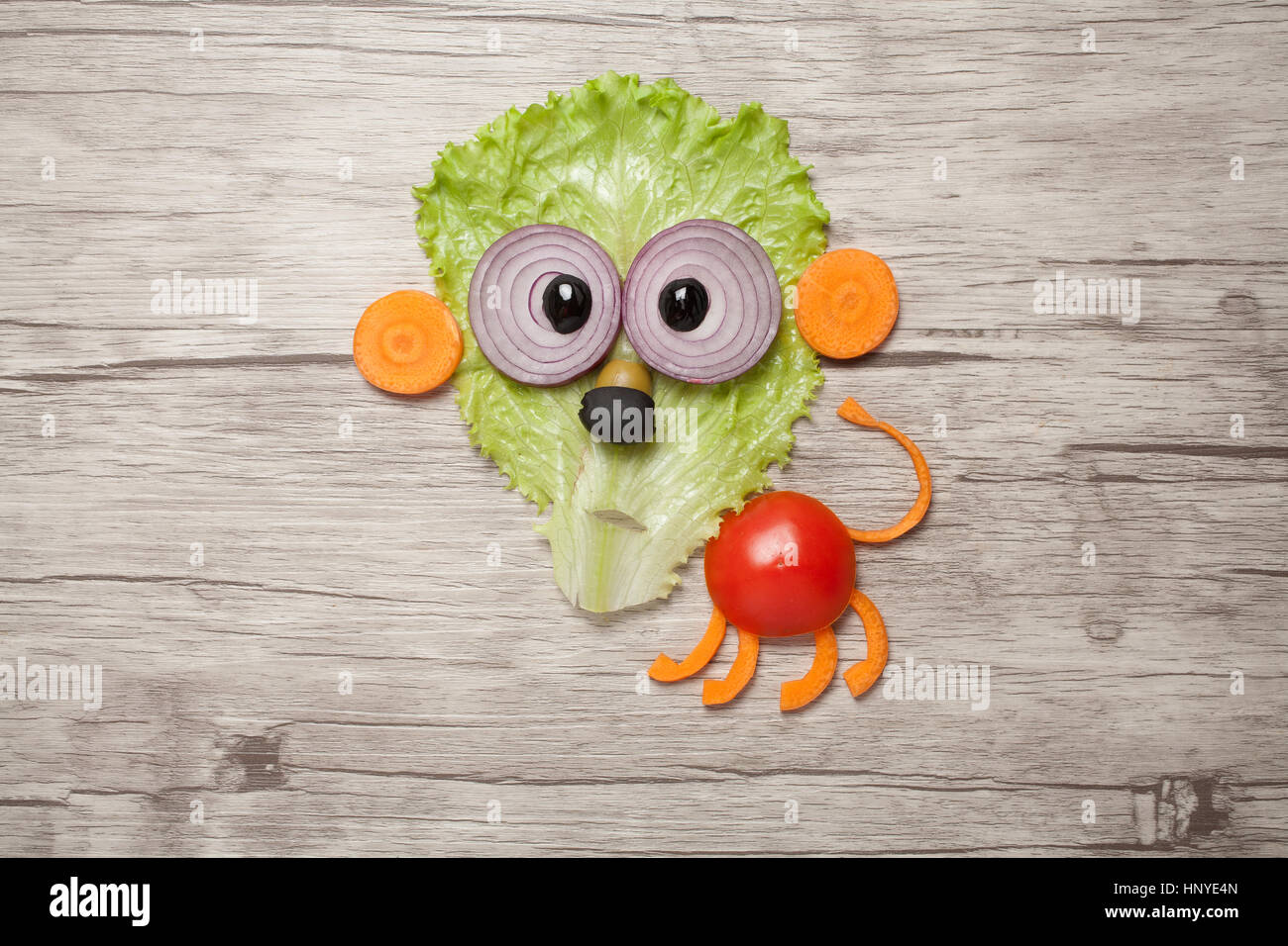 Funny lion made of vegetables on wooden table Stock Photo - Alamy