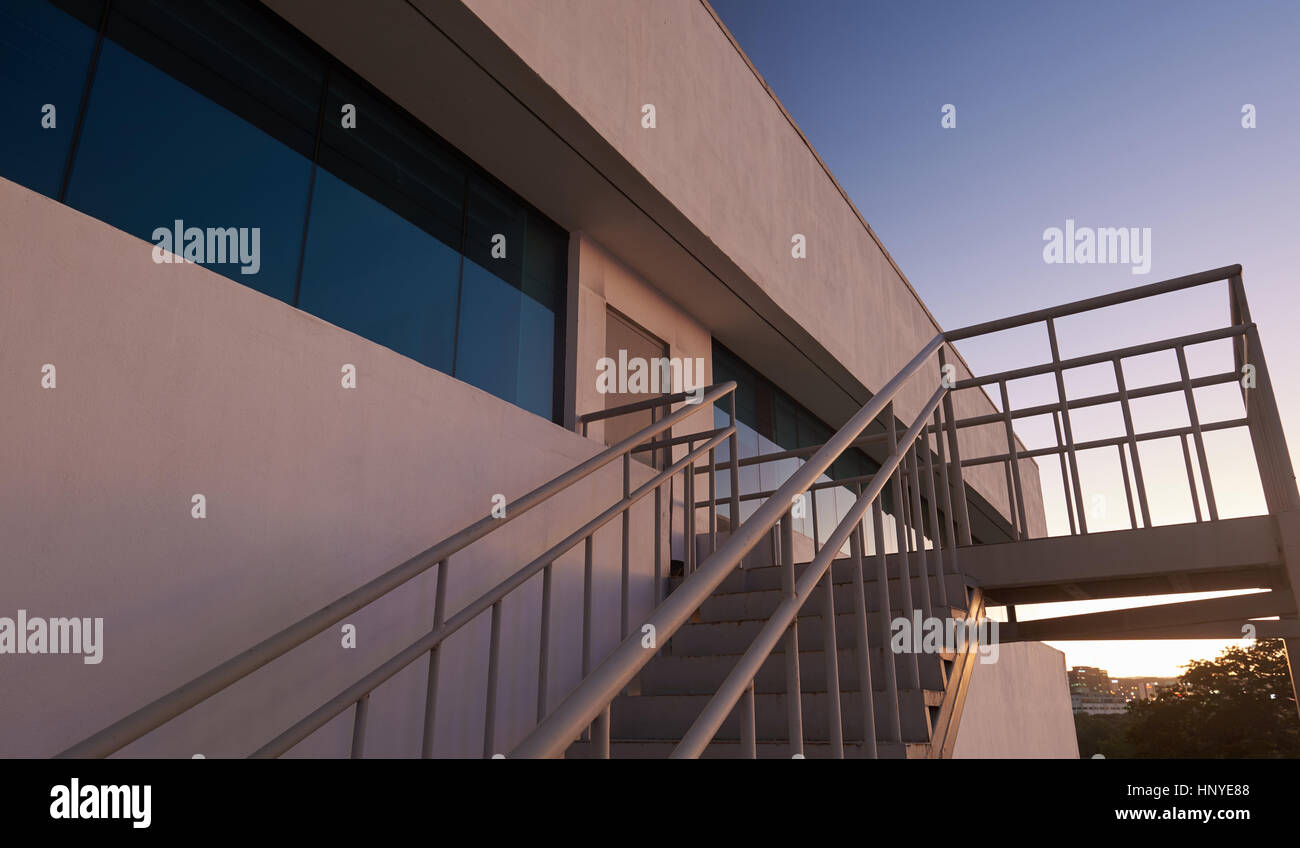 Emergency exit in office building with big windows at night Stock Photo ...
