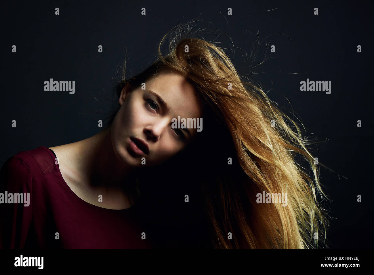 The hand in her hair. Beautiful young girl dancing. Hair flying ...