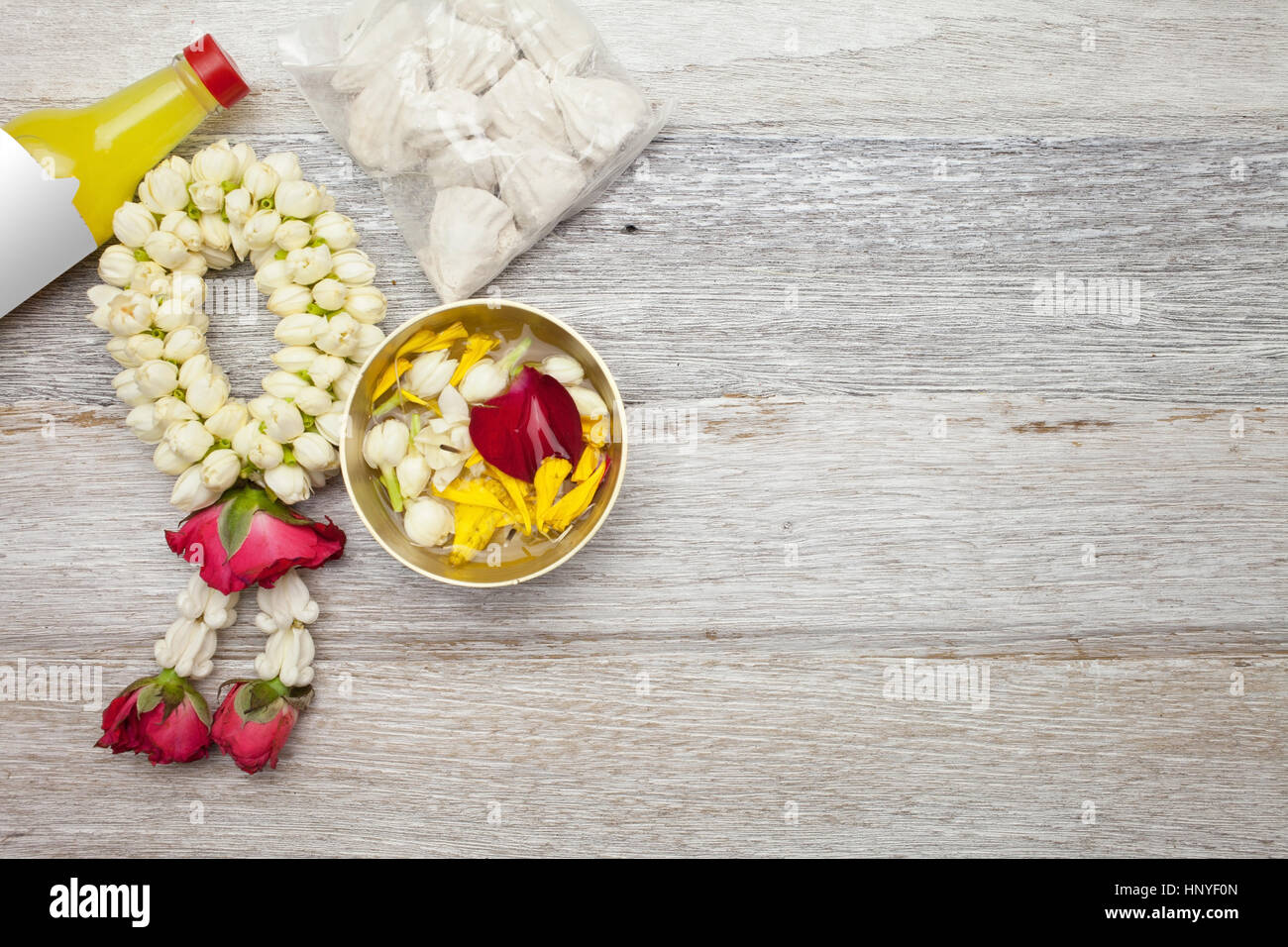 Songkran Festival : Perfume,Garland,floral,power and gun on white ...