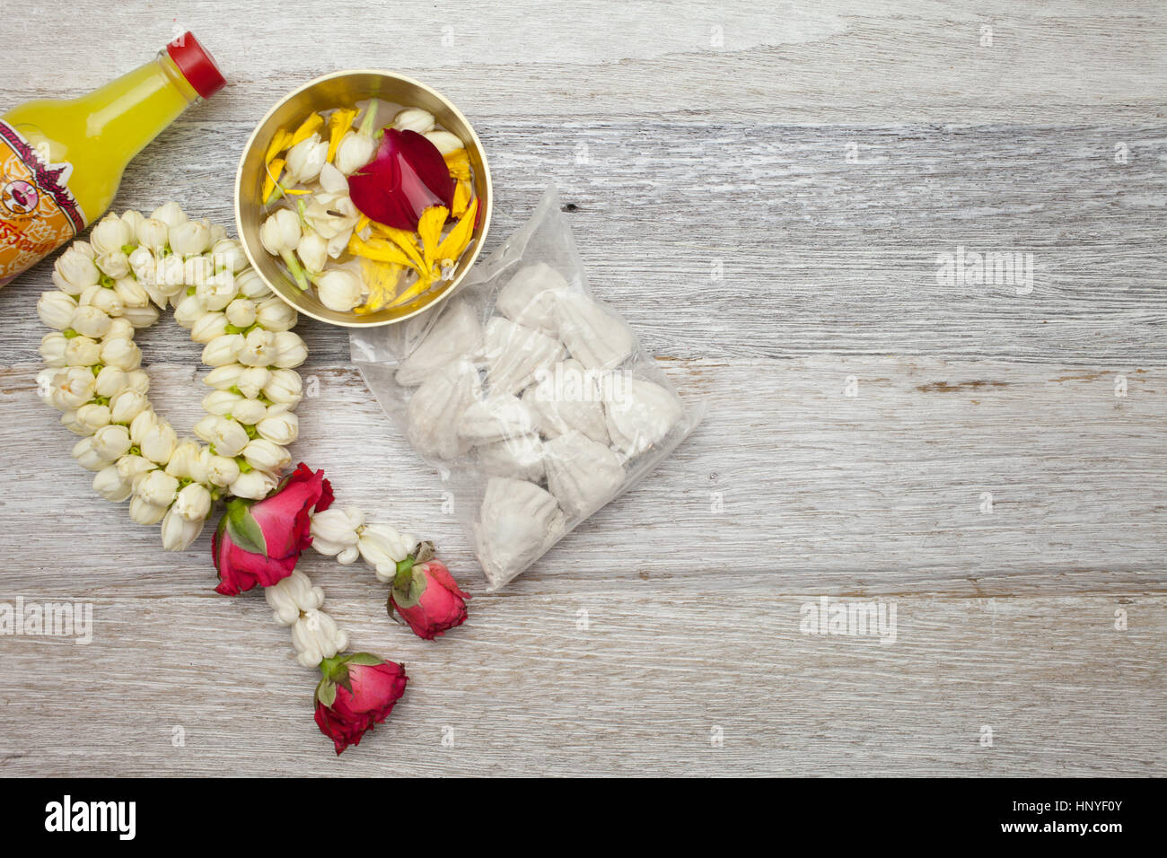 Songkran Festival : Perfume,Garland,floral,power and gun on white ...