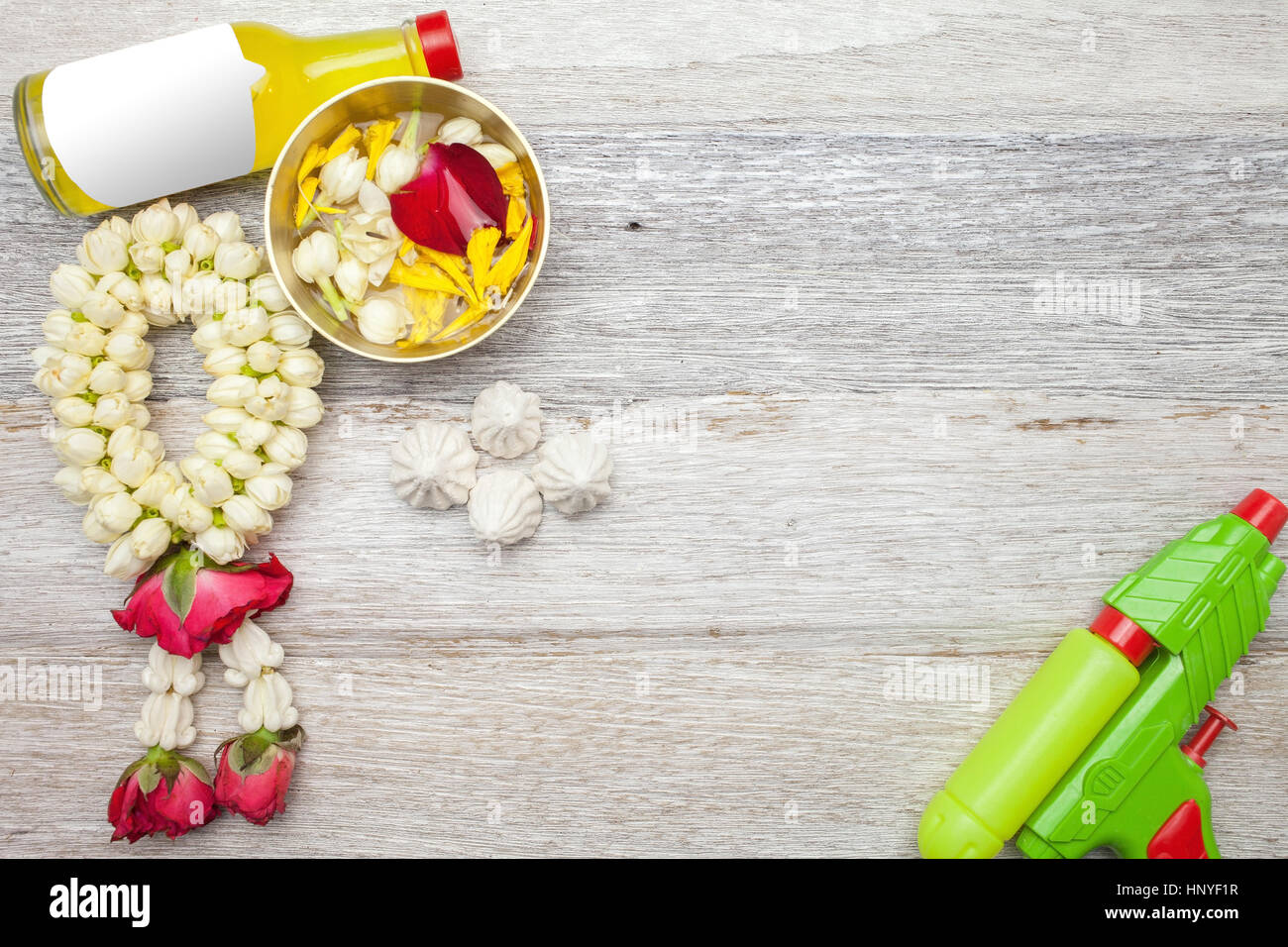 Songkran Festival : Perfume,Garland,floral,power and gun on white ...