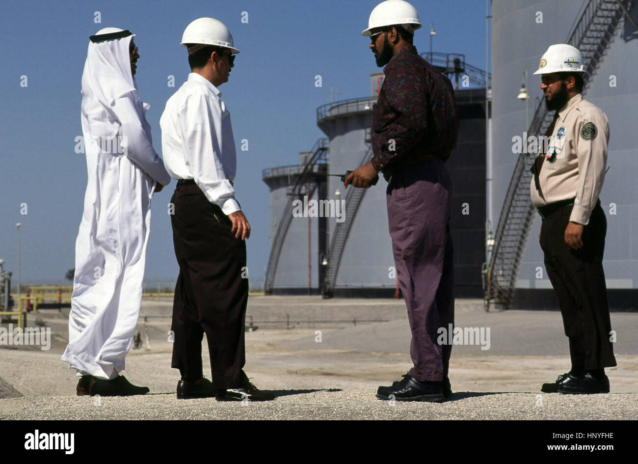 RAS TANURA, SAUDI ARABIA -- SAUDI ARAMCO OFFICIALS AND SECURITY GUARDS ...