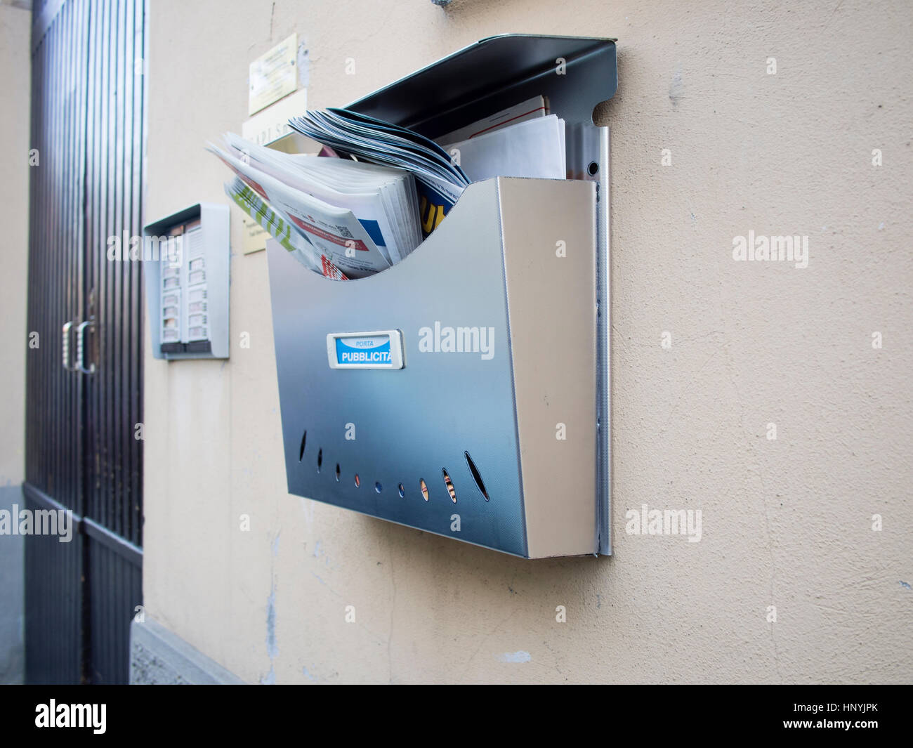 Letterbox with unsolicited advertising Stock Photo - Alamy