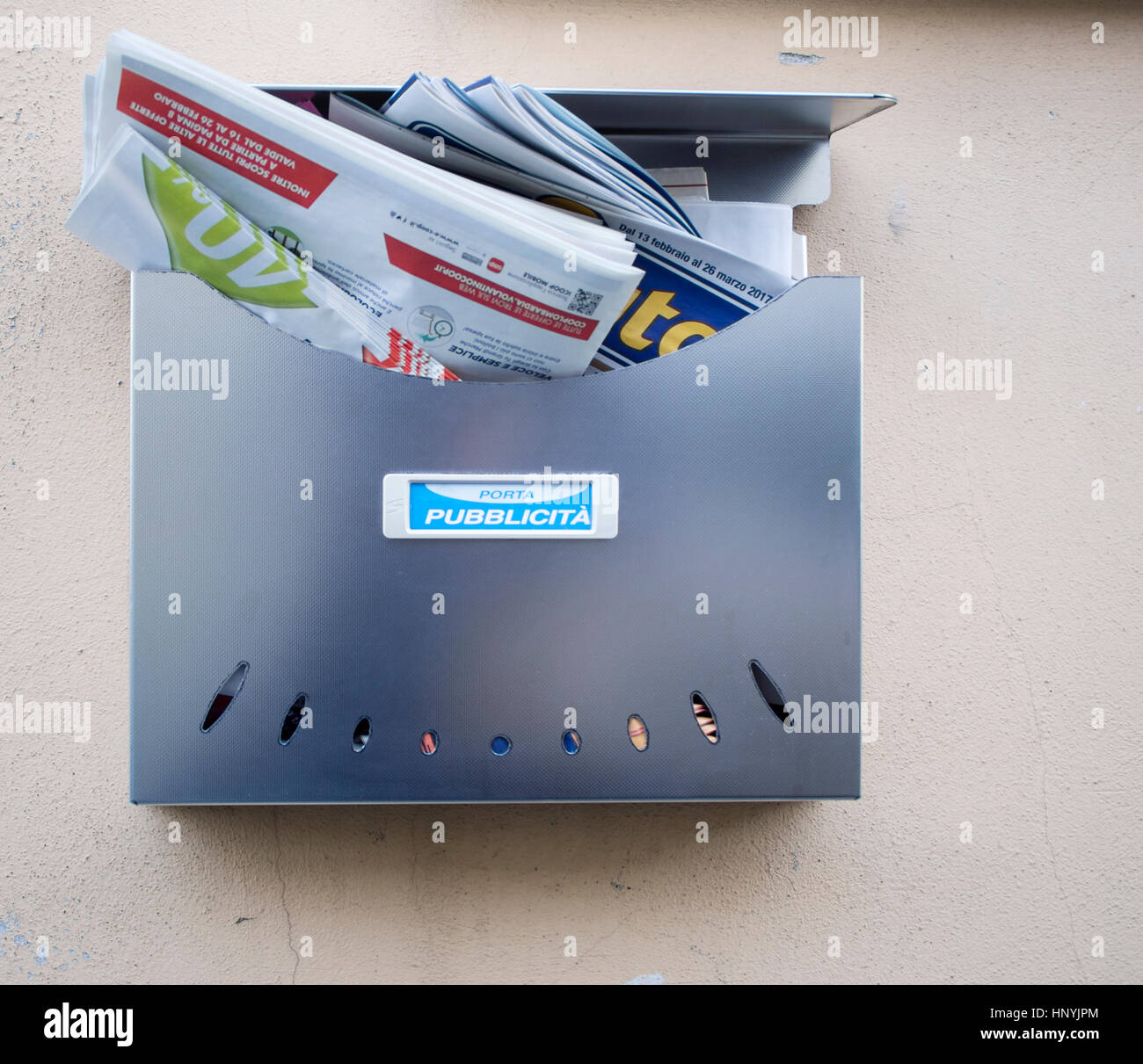 Letterbox with unsolicited advertising Stock Photo - Alamy