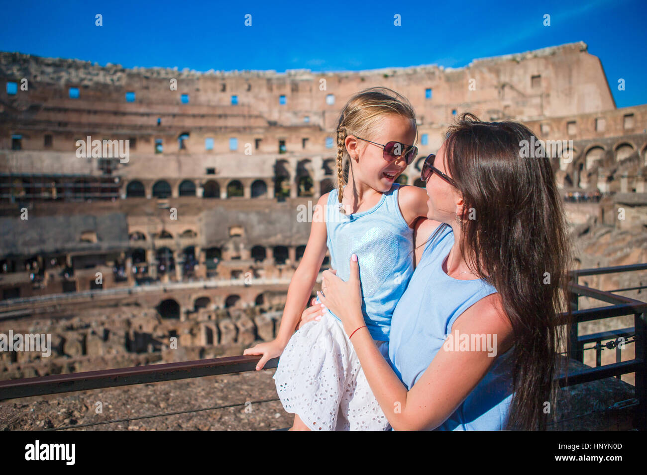 Happy family in Rome over Colosseum background Stock Photo - Alamy