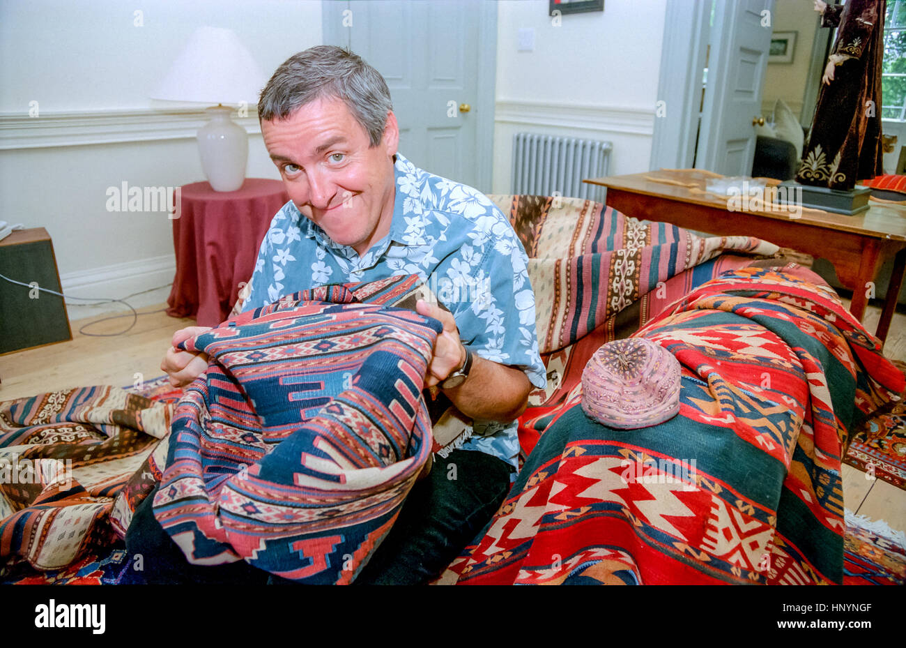 Griff Rhys-Jones at his home in Fitzroy Square, London, demonstrating ...