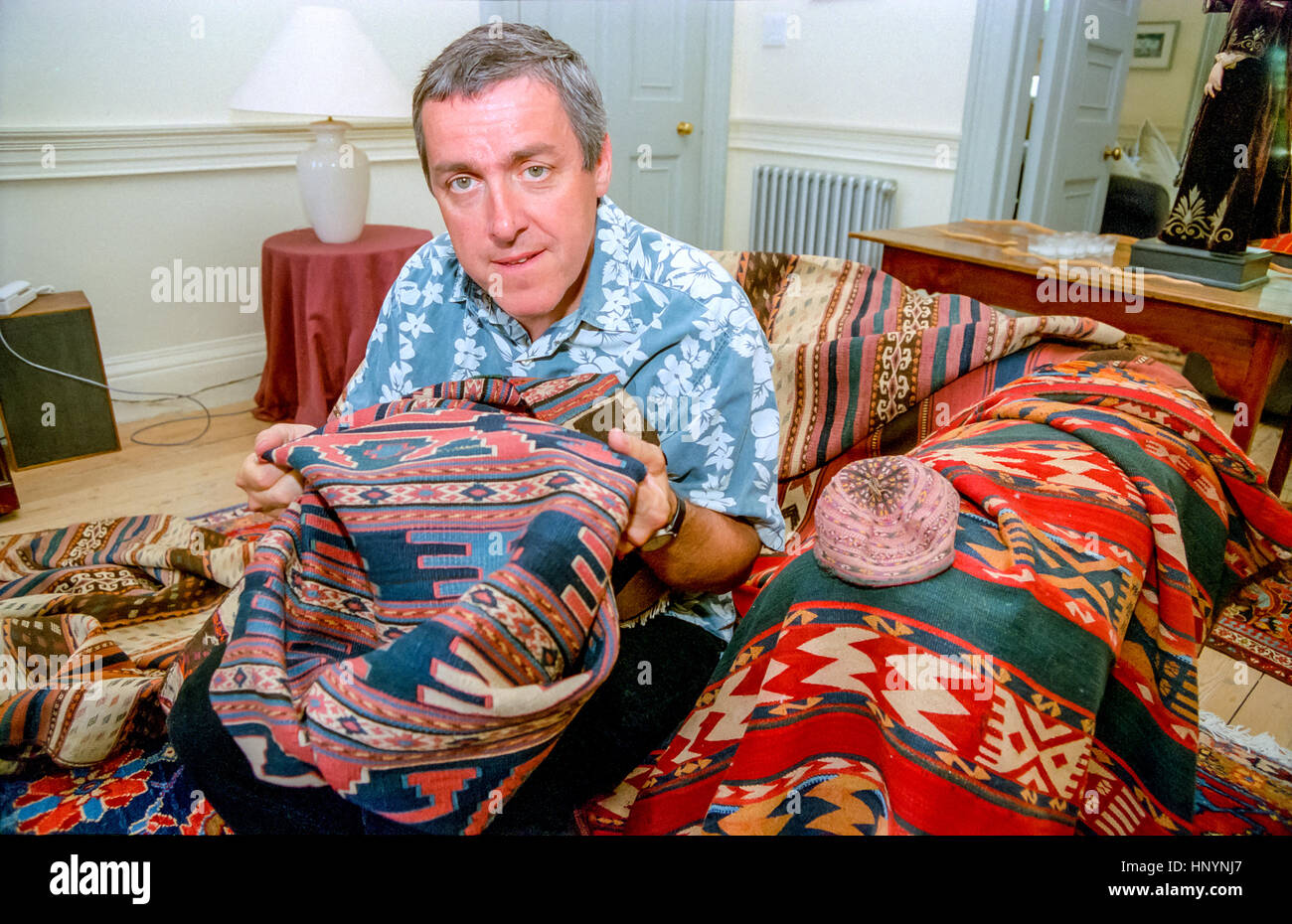 Griff Rhys-Jones at his home in Fitzroy Square, London, demonstrating ...