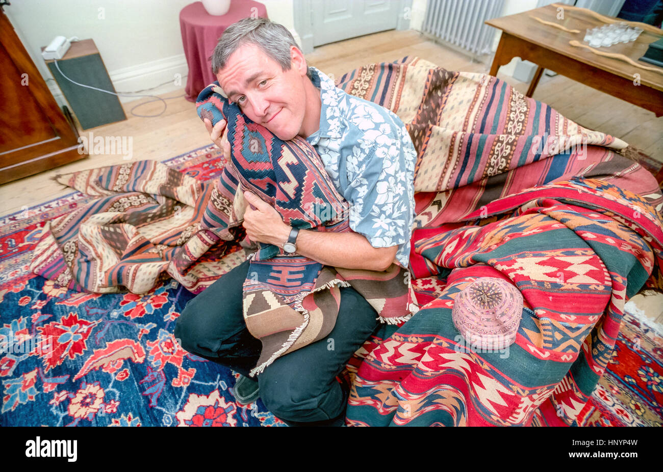 Griff Rhys-Jones at his home in Fitzroy Square, London, demonstrating ...