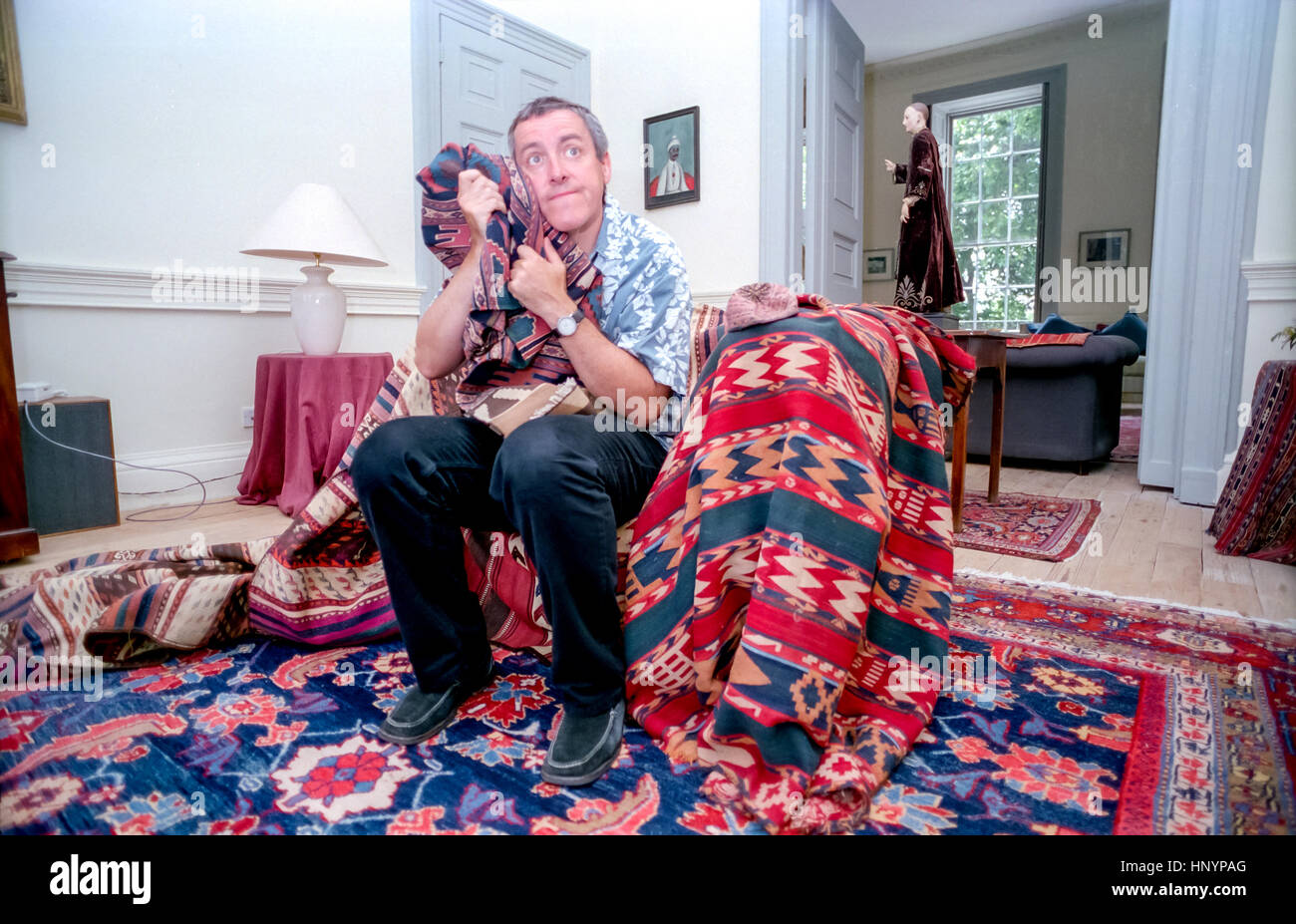 Griff Rhys-Jones at his home in Fitzroy Square, London, demonstrating ...