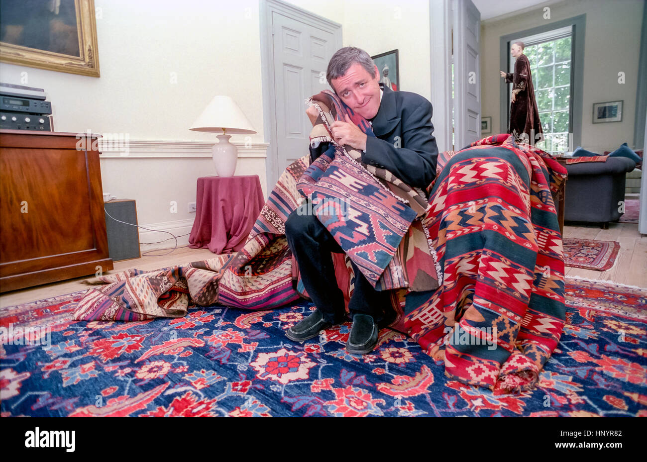 Griff Rhys-Jones at his home in Fitzroy Square, London, demonstrating ...
