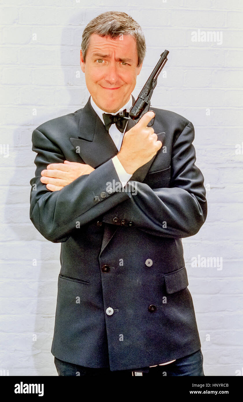 Actor and comedian Griff Rhys-Jones poses as James Bond at his London ...