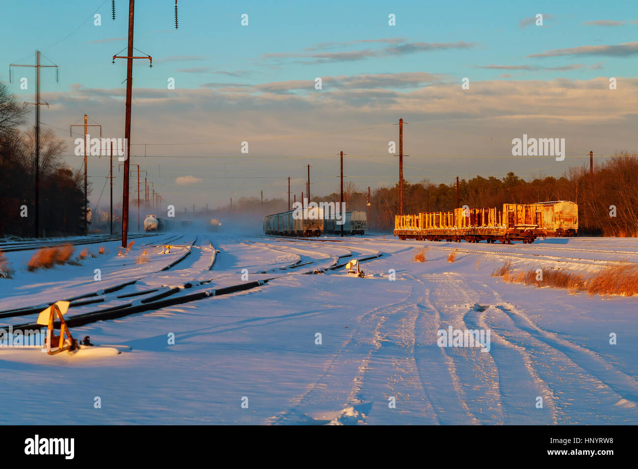 rail landscape. snowing sky clouds road Train winter Stock Photo - Alamy