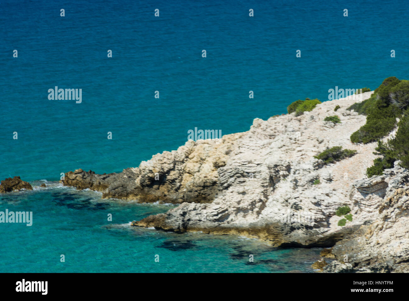 Isolated rock in the sea, on the beaches of Greece and Sicily Stock ...