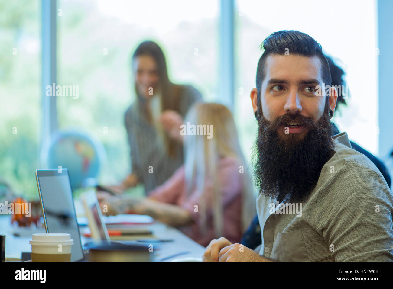 Freelance worker using shared office space Stock Photo - Alamy