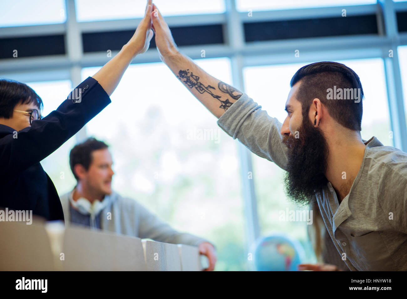 Self congratulating hi-res stock photography and images - Alamy