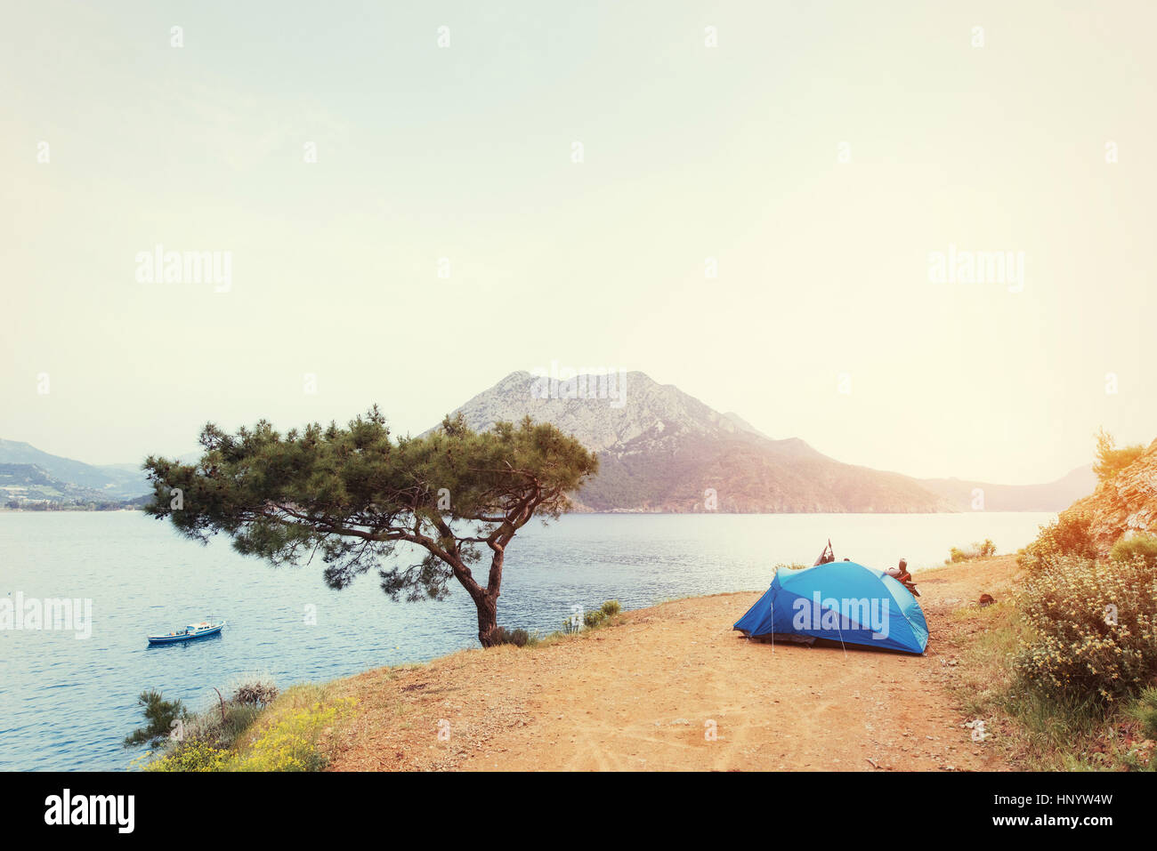 Blue tent on sandy wild beach at sunset light. Turkey Stock Photo - Alamy