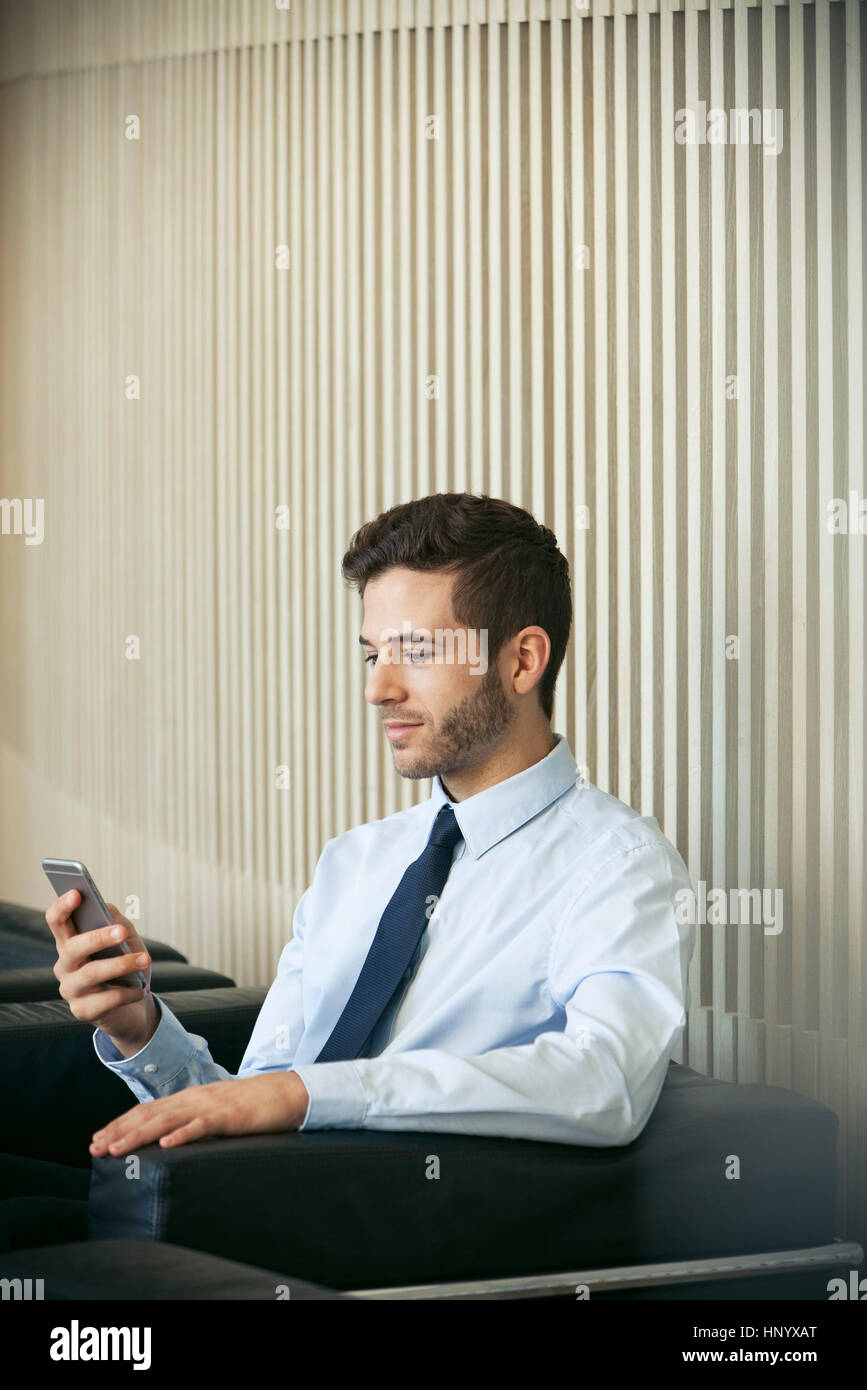 Businessman using smartphone Stock Photo - Alamy