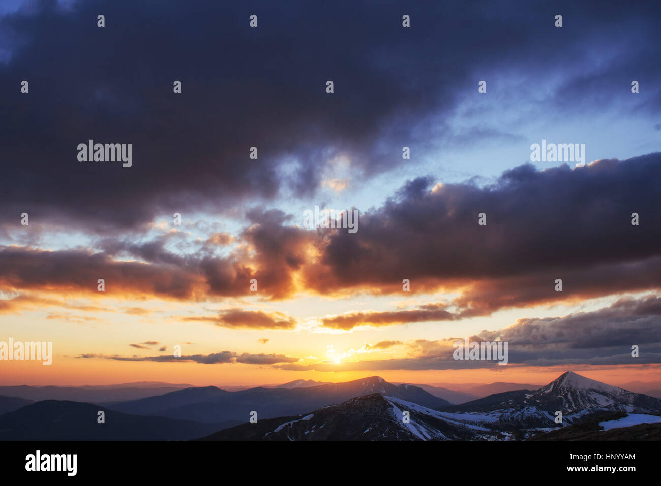 Colorful spring sunset over the mountain ranges in the national Stock ...