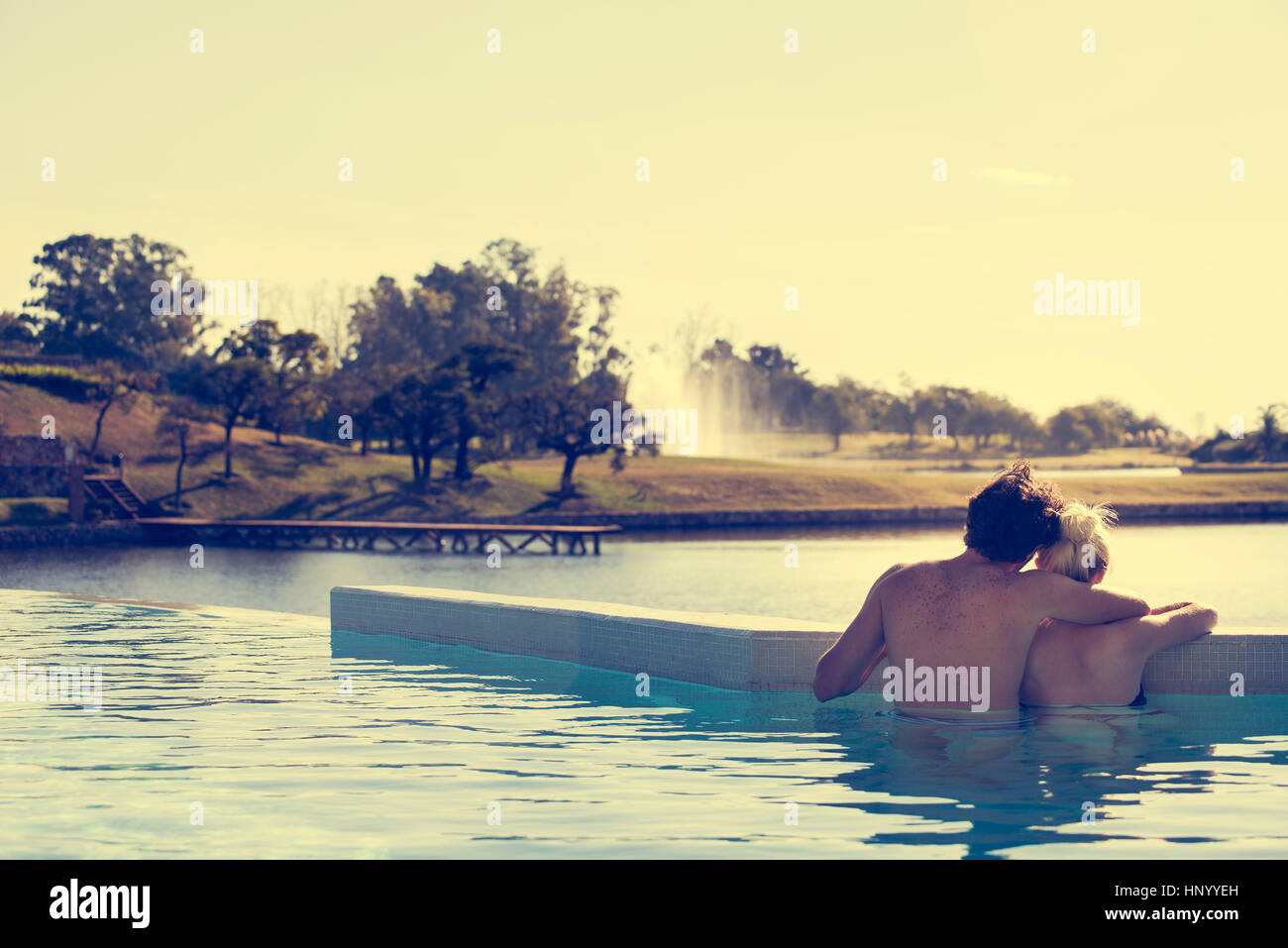 Couple in infinity pool hi-res stock photography and images - Alamy