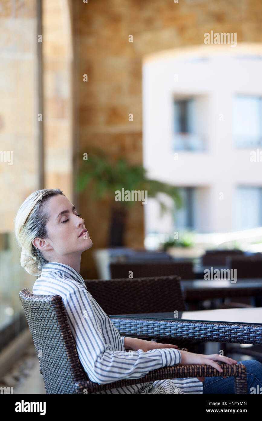 Woman dozing in armchair Stock Photo - Alamy