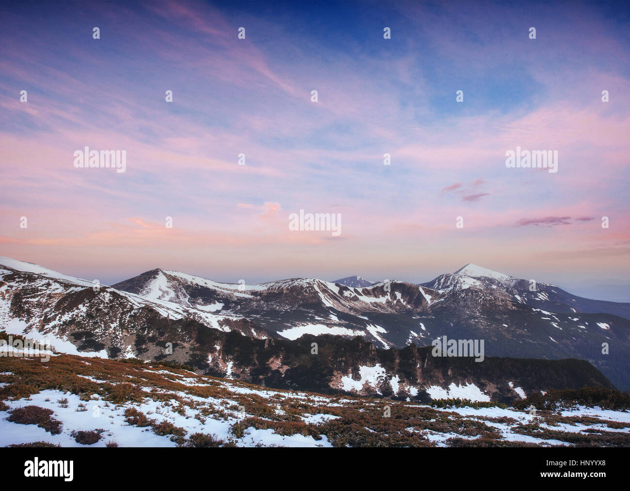 Colorful spring sunset over the mountain ranges in the national Stock ...