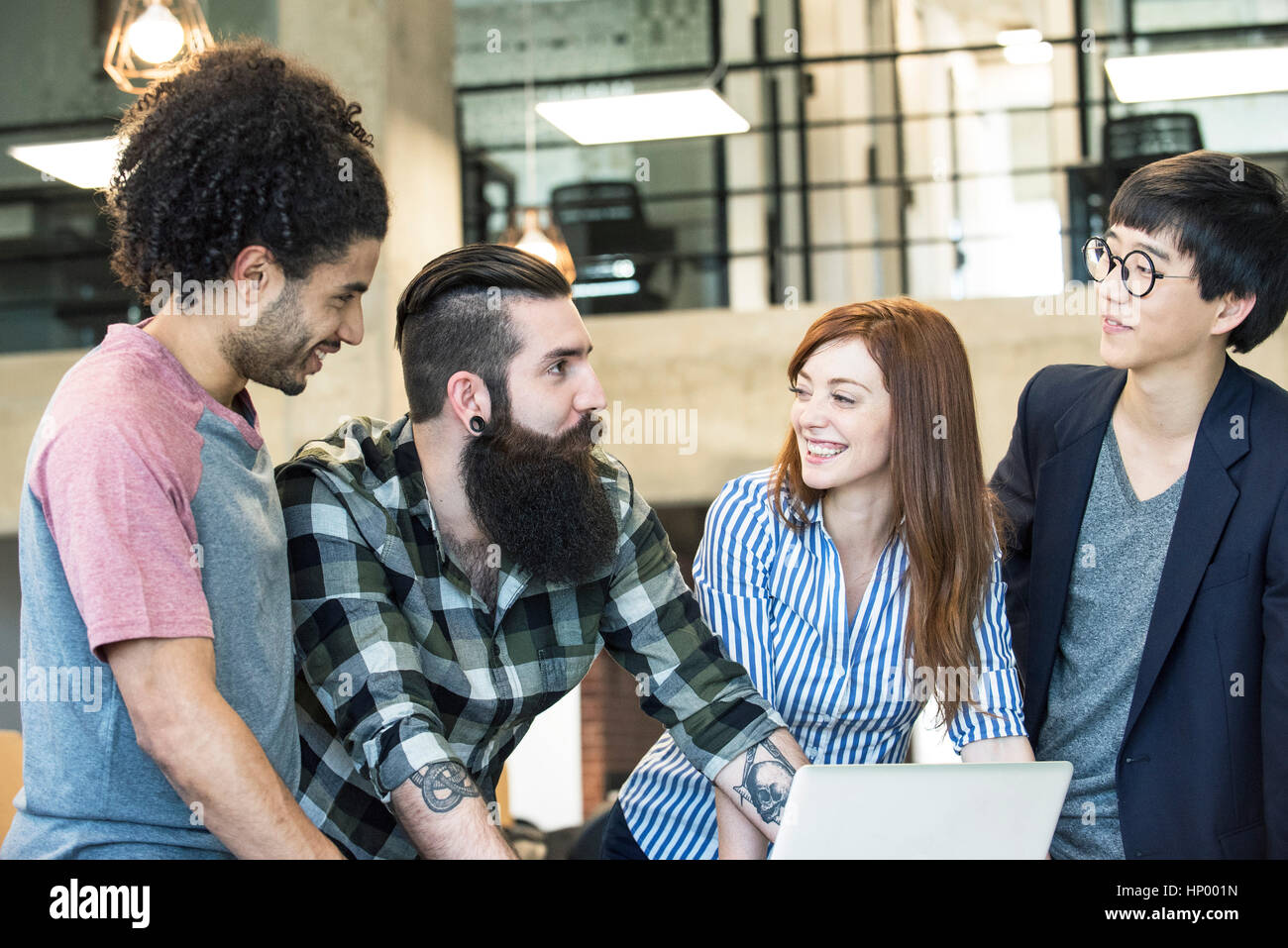 Team of collegues collaborating in office Stock Photo - Alamy
