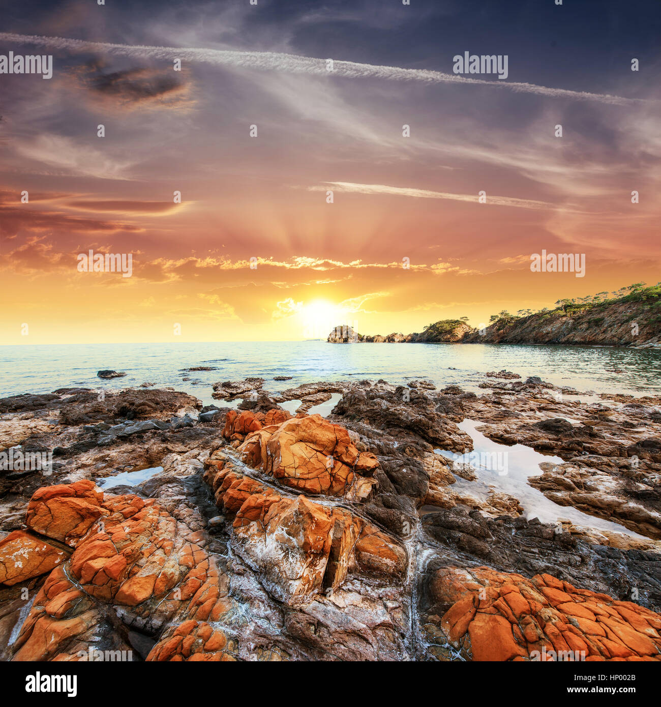 beautiful stones on the beach at sunset Stock Photo - Alamy