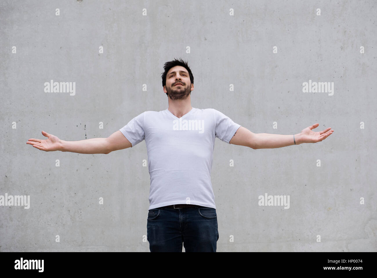 Man with arms outstretched Stock Photo - Alamy