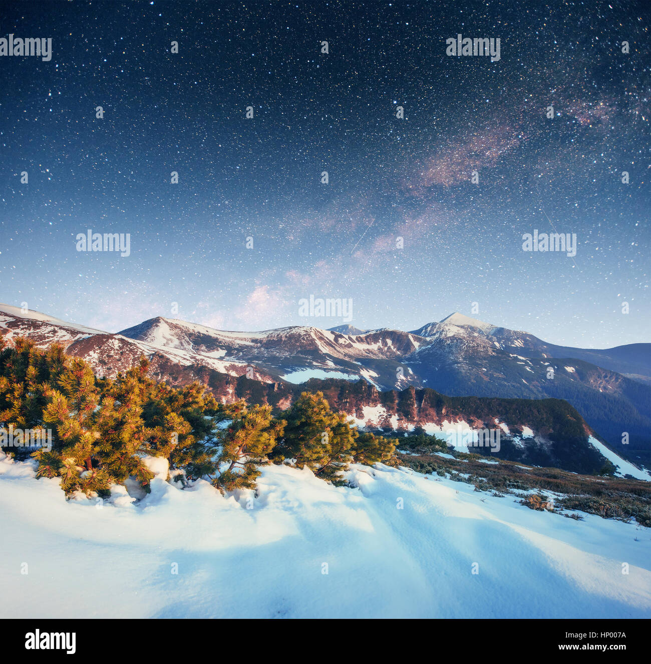 starry sky in winter snowy night. fantastic milky way Stock Photo - Alamy