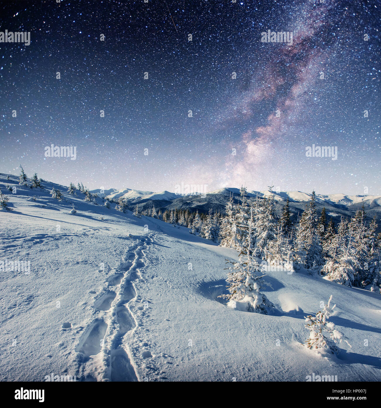 starry sky in winter snowy night. fantastic milky way Stock Photo - Alamy