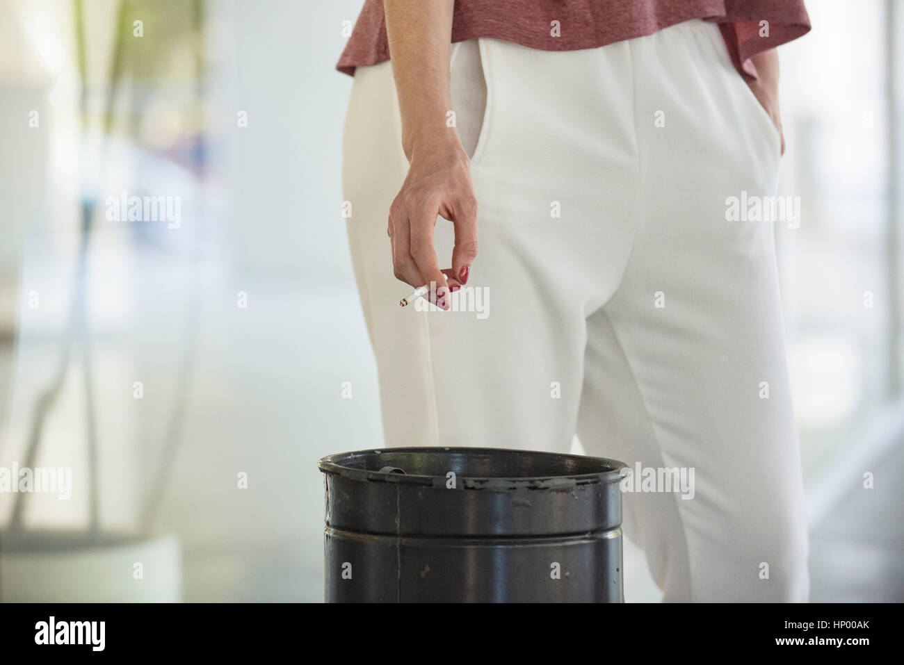 Woman on a cigarette break, cropped Stock Photo - Alamy